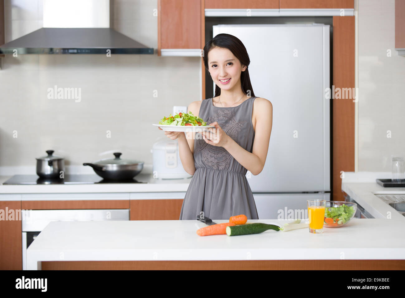 Young woman cooking in the kitchen Stock Photo - Alamy