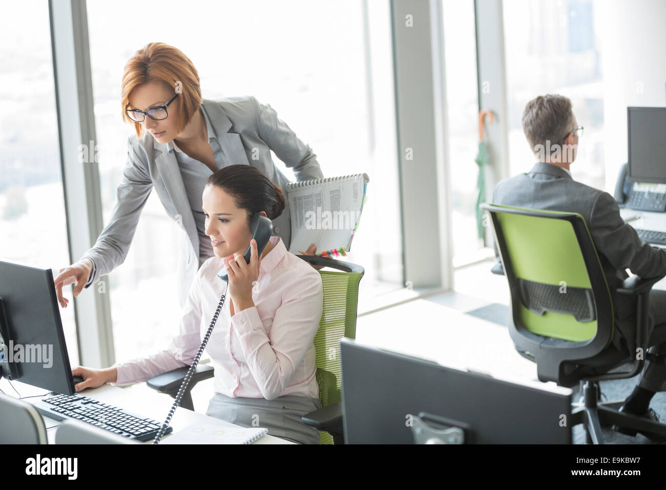 Business people working in office Stock Photo - Alamy