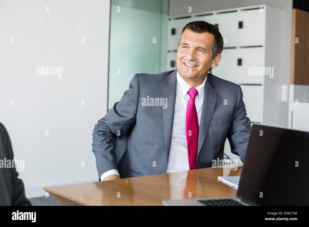 Men suits sitting desk hi-res stock photography and images - Alamy