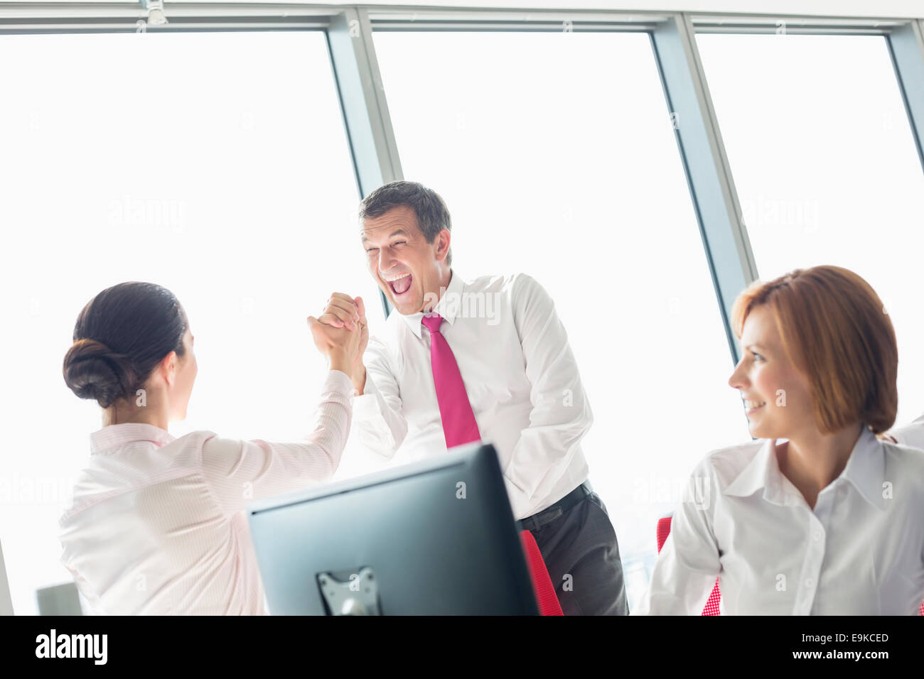 Business people celebrating success in hi-res stock photography and ...