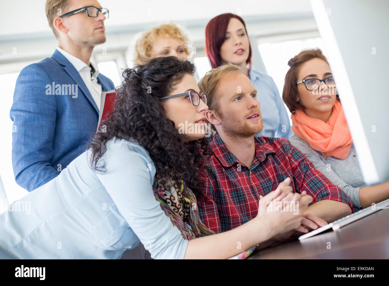 Business people using computer in office Stock Photo - Alamy