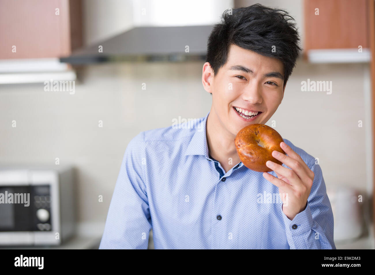 Young man eating bread hi-res stock photography and images - Alamy