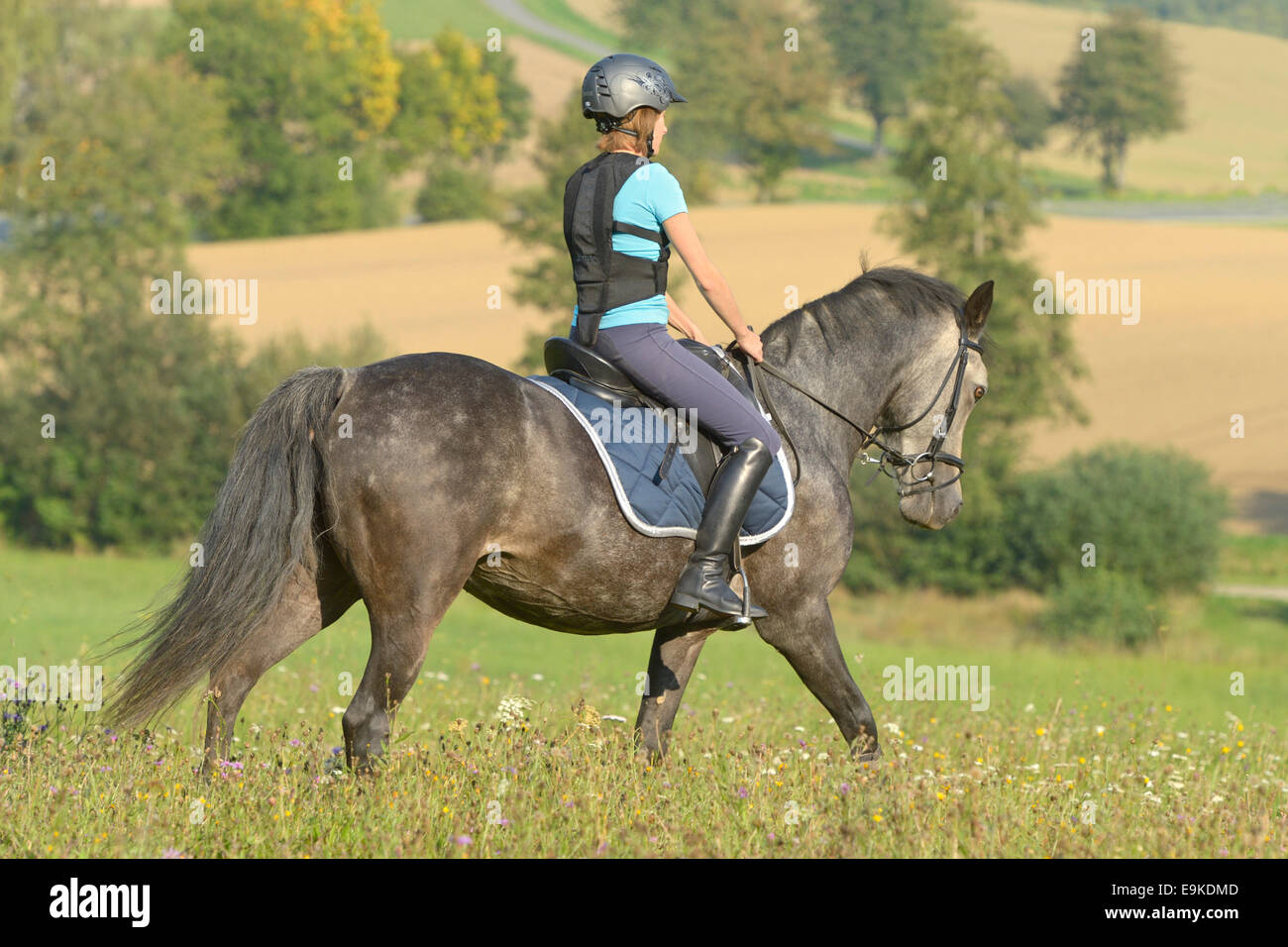 Back view young woman riding hi-res stock photography and images - Alamy