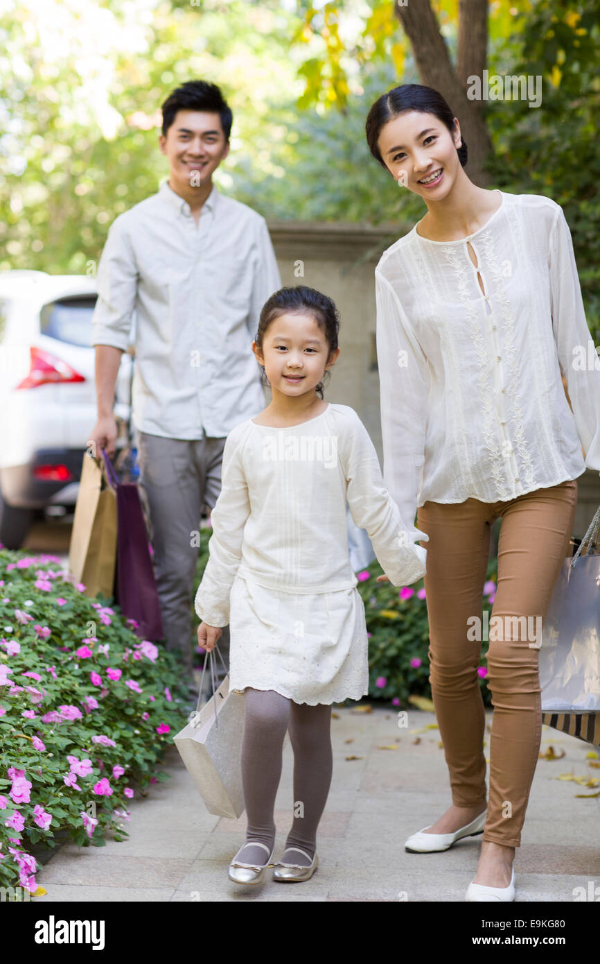 Young family coming back from shopping Stock Photo - Alamy