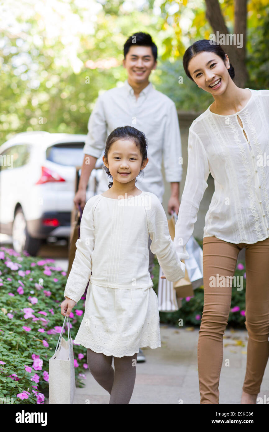 Young family coming back from shopping Stock Photo - Alamy