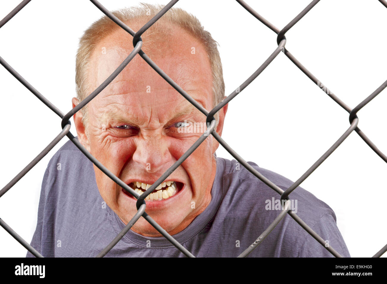 Angry man behing bars Stock Photo - Alamy