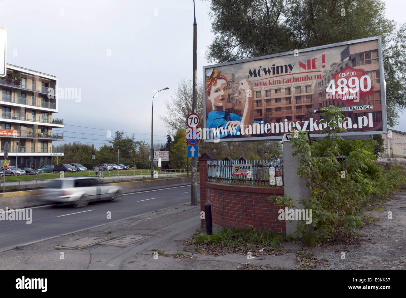 Krakow, Poland. 15th Oct, 2014. New apartments priced on a billboard ...