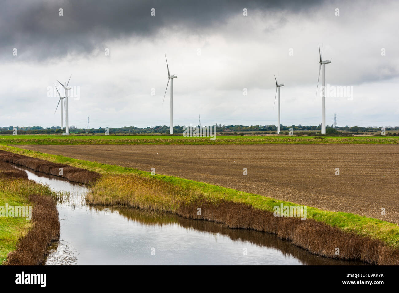 Small wind farm in flat, coastal farmland.Renewable energy Stock Photo ...