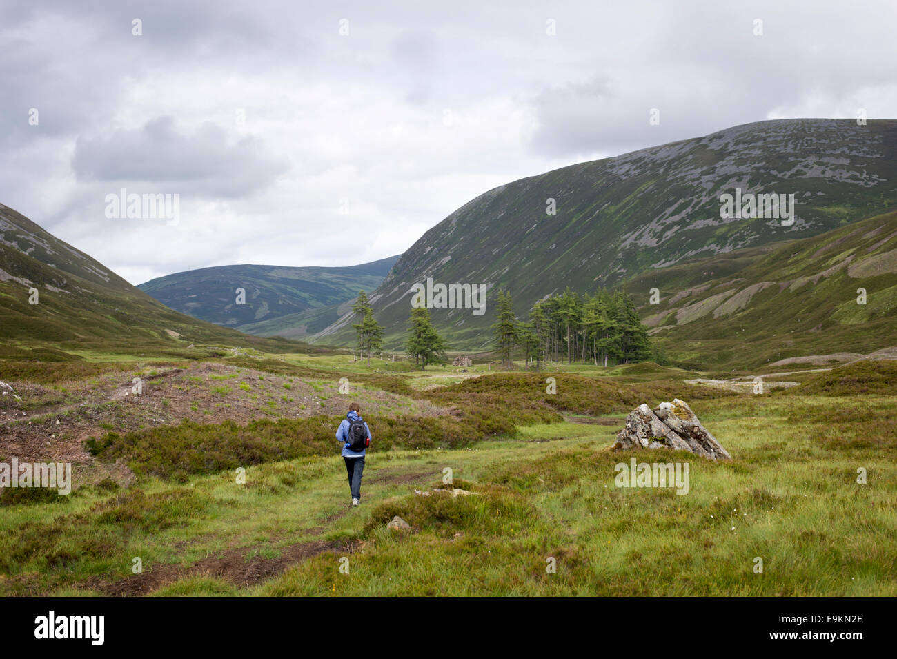 A female walker treks along a path in the upper reached of Glen Ey near ...