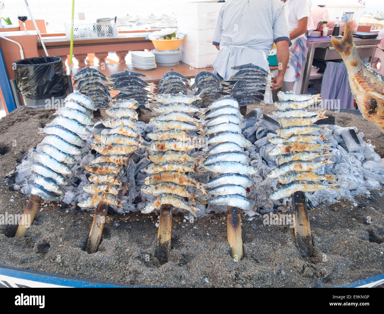 typical sardines espeto cooking in Malaga Spain Stock Photo - Alamy