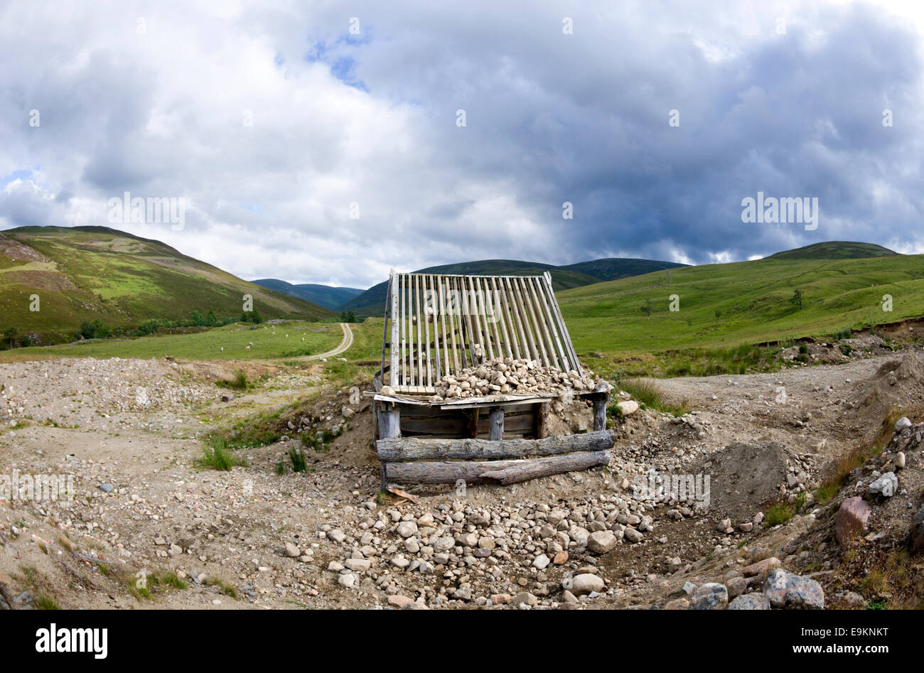 an old device for sorting and sifting stones for use on paths and walls ...