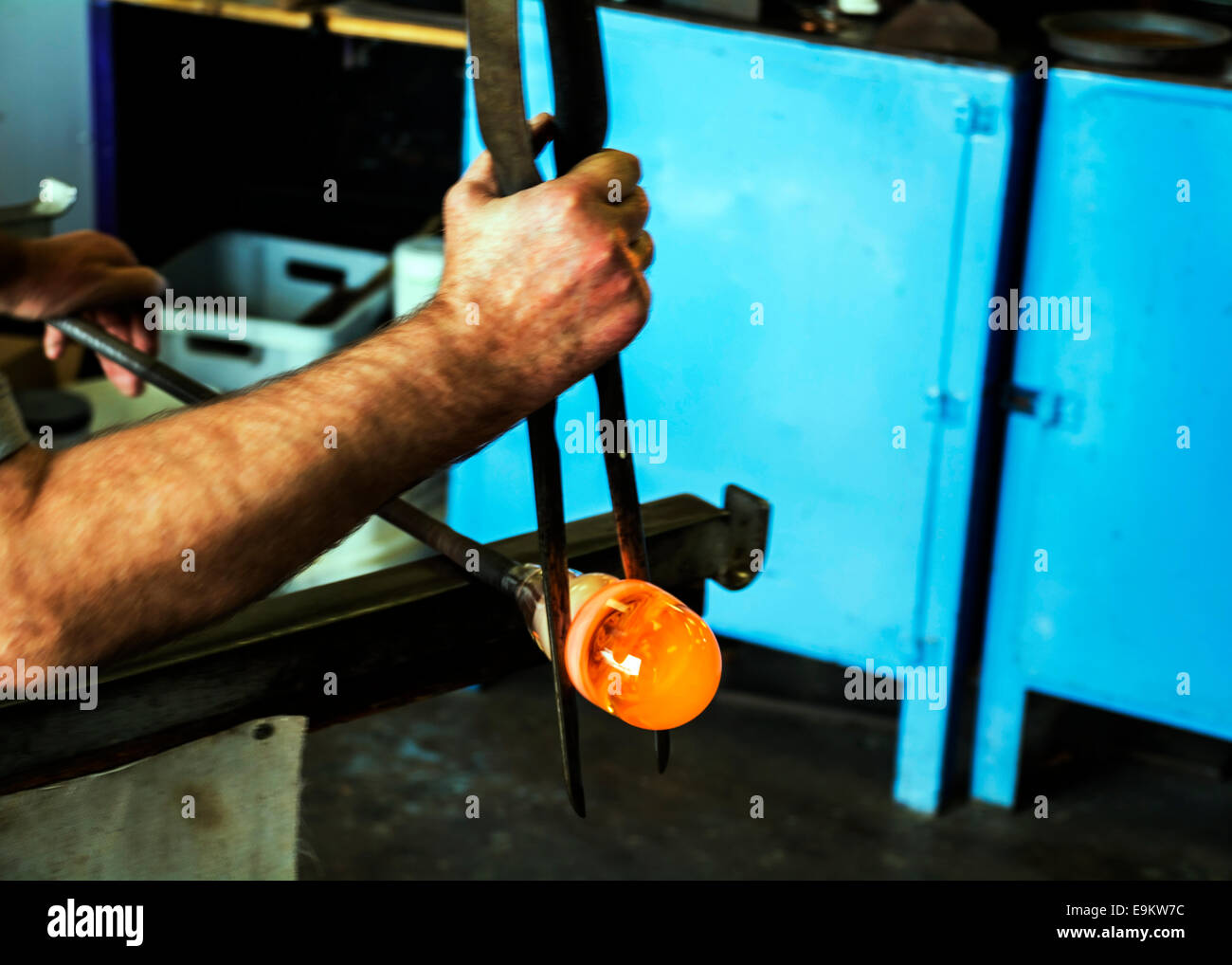Shaping molten glass to a paperweight in production Stock Photo - Alamy