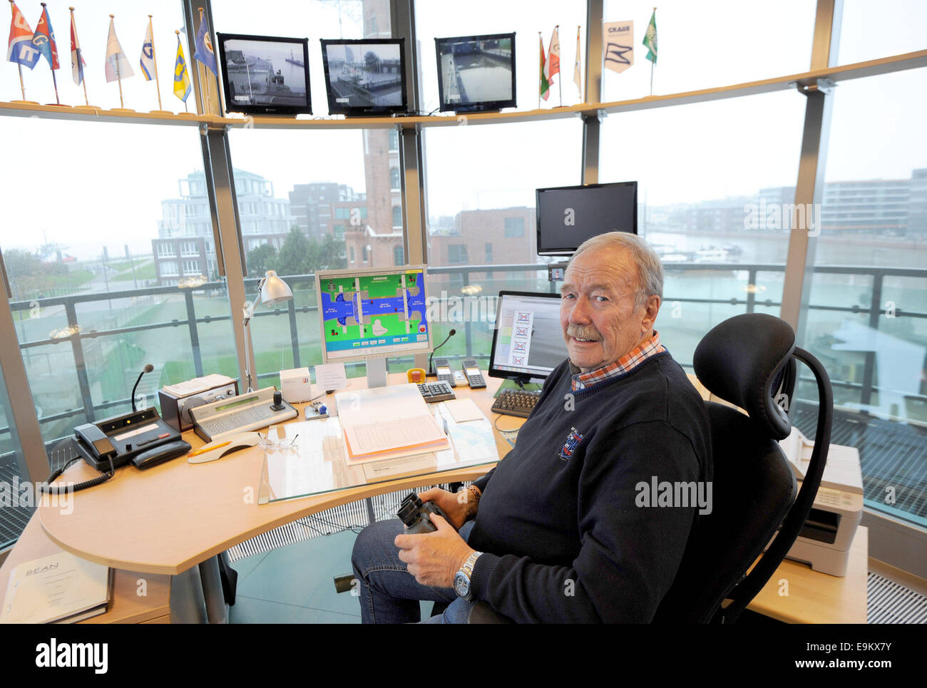 The lock operator sits at his command station and waits on sports boats ...