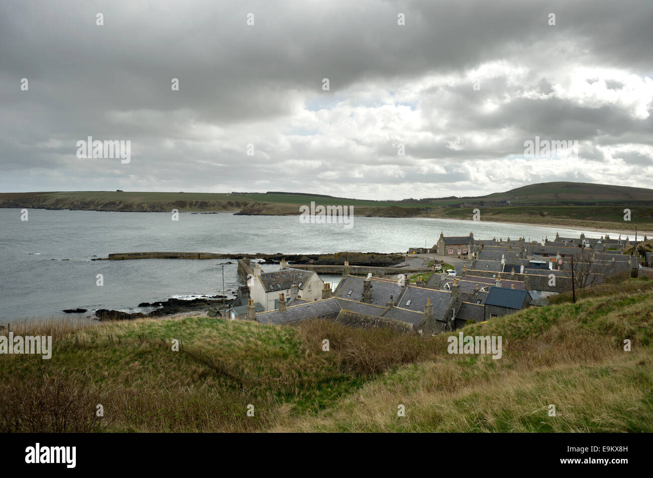 Looking down onto Sandend harbour village and bay from the coastal ...