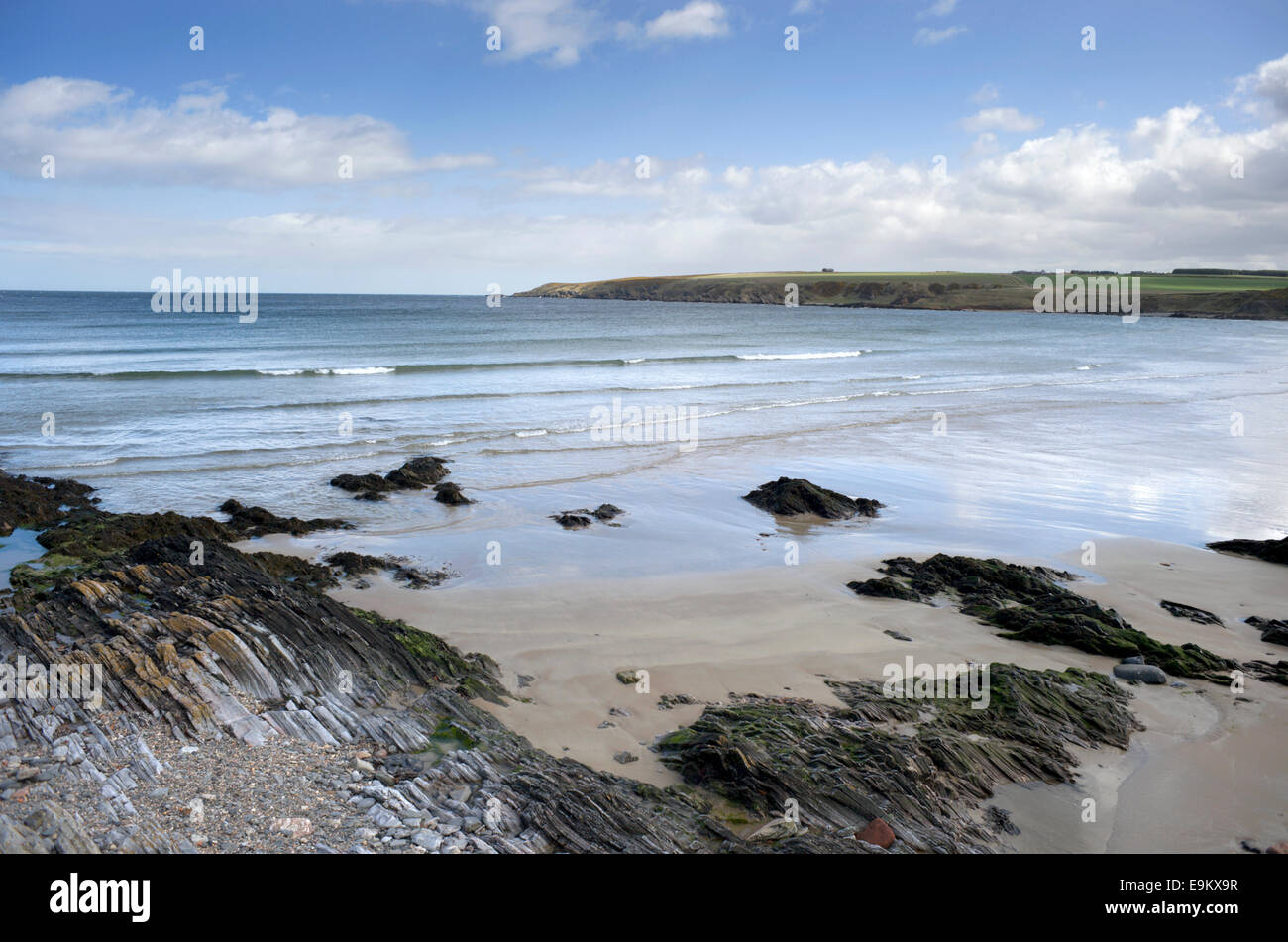 Looking across the tranquil bay at Sandend from the Nave Nortrail ...