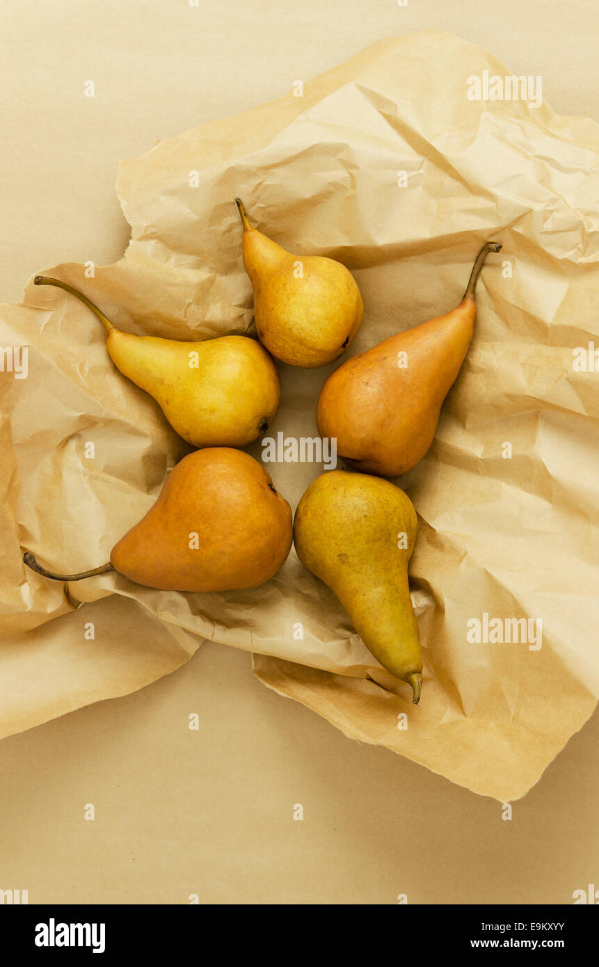 Multiple ripe pears over brown paper background. Above view Stock Photo ...