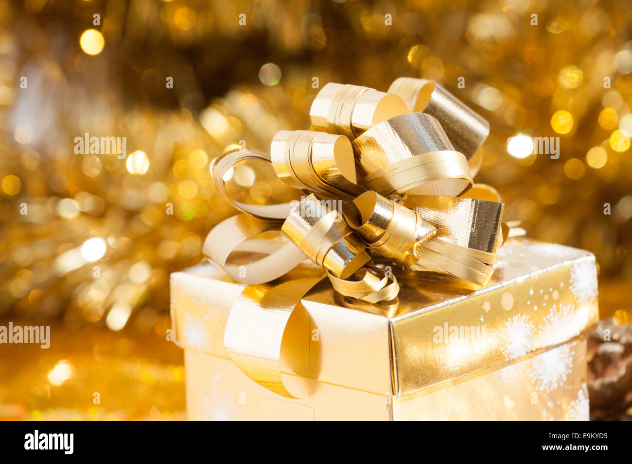 Golden Christmas background with present box Stock Photo - Alamy
