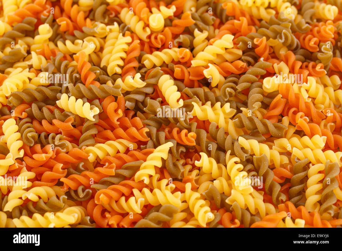Colorful pasta as a background Stock Photo - Alamy