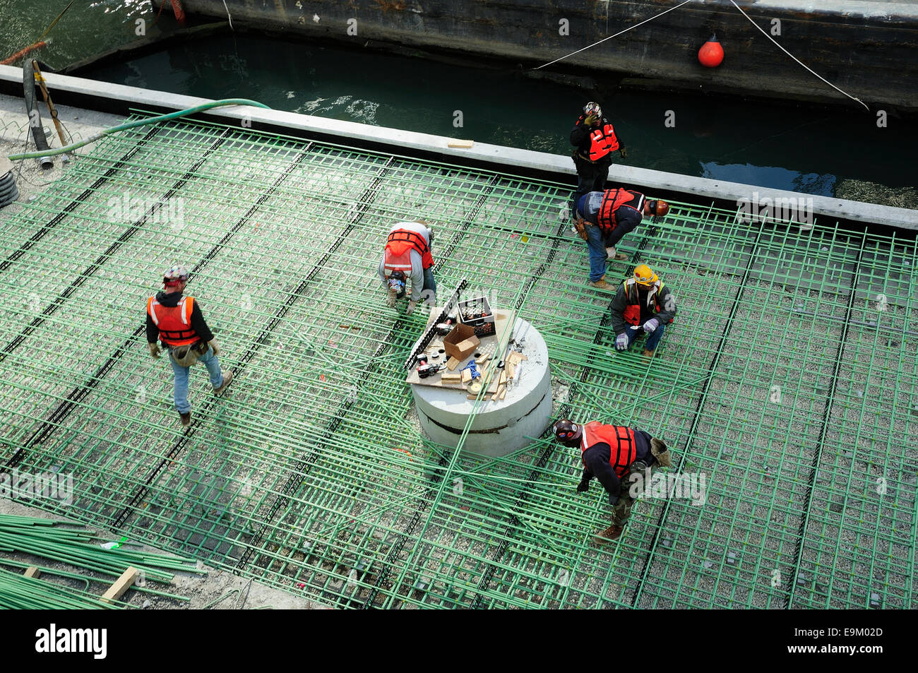 Chicago construction workers laying rebarb for the new "Riverwalk ...