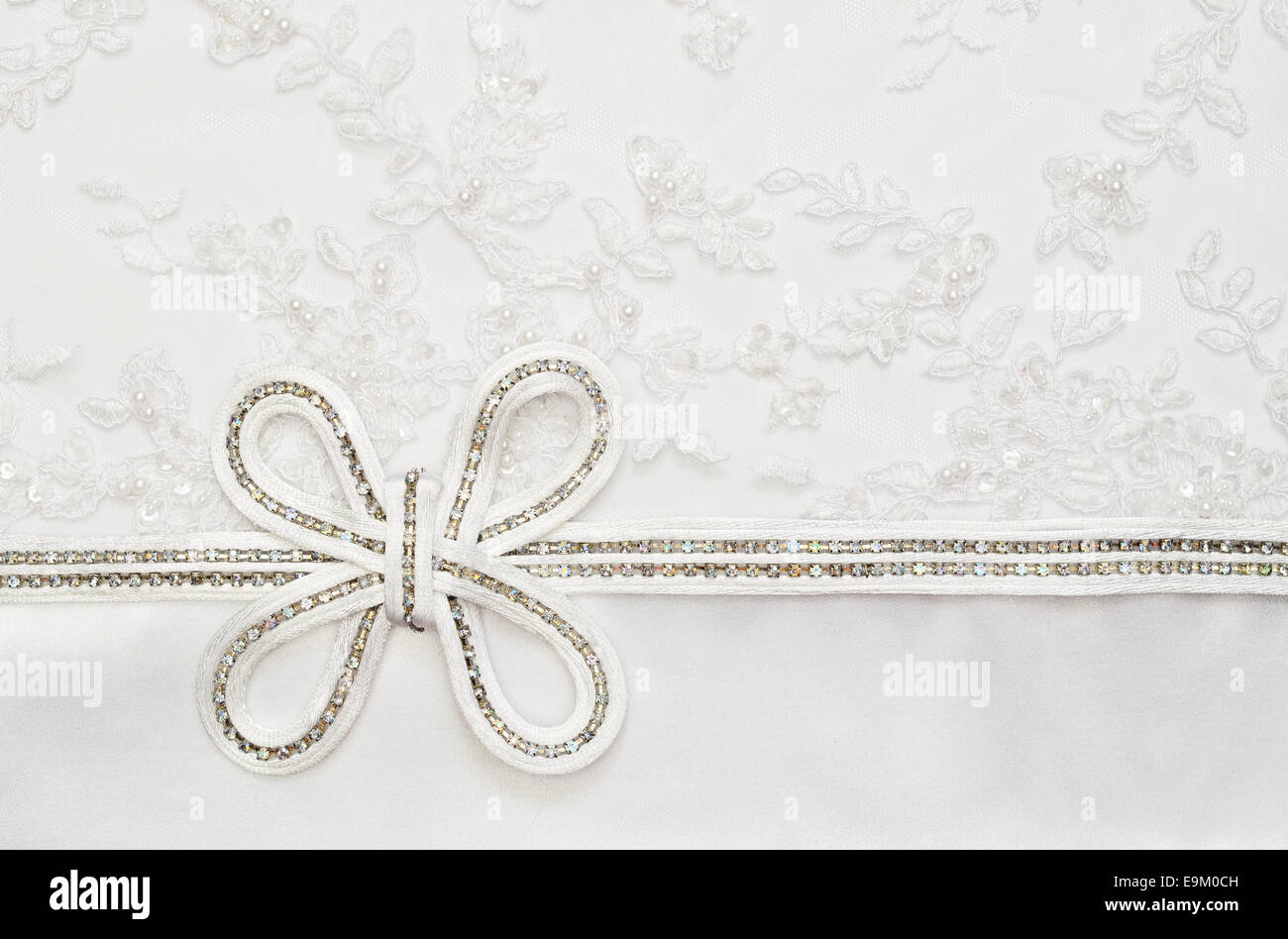 Wedding bow on lace background Stock Photo - Alamy