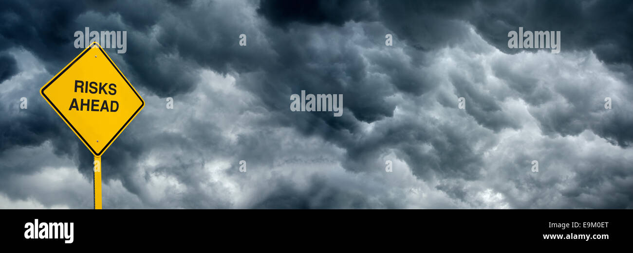 Warning Sign in Front of Storm Clouds Stock Photo - Alamy