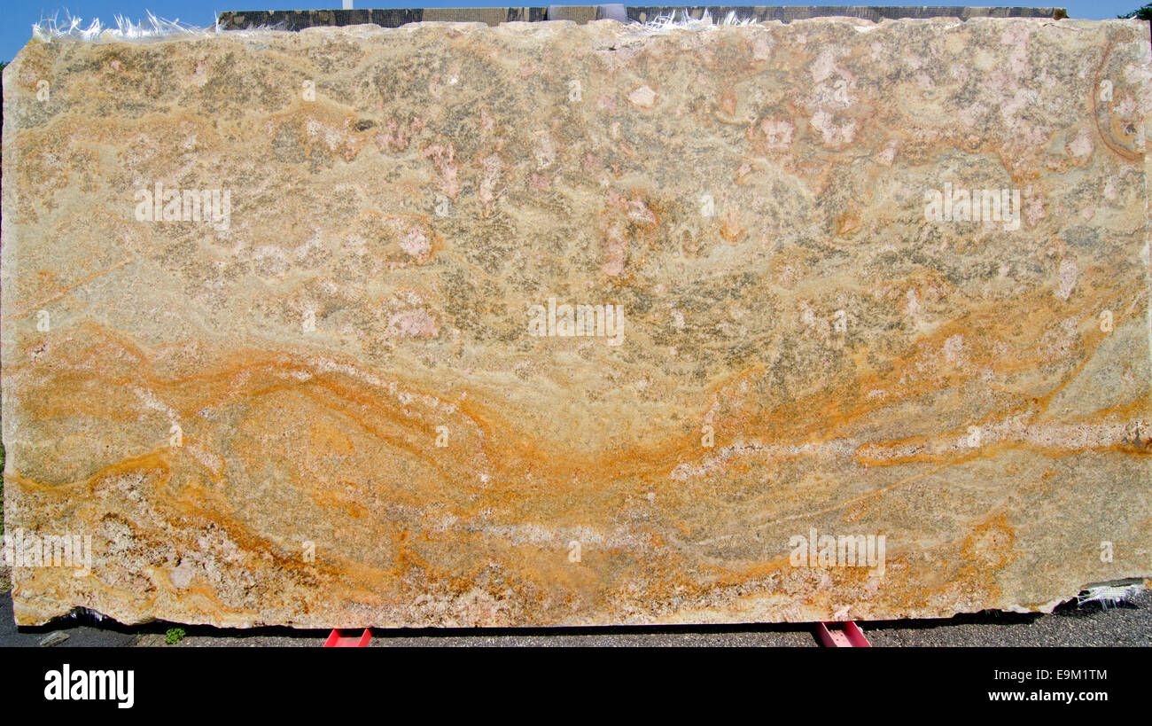A full slab of cut and polished Granite makes a background of textures ...