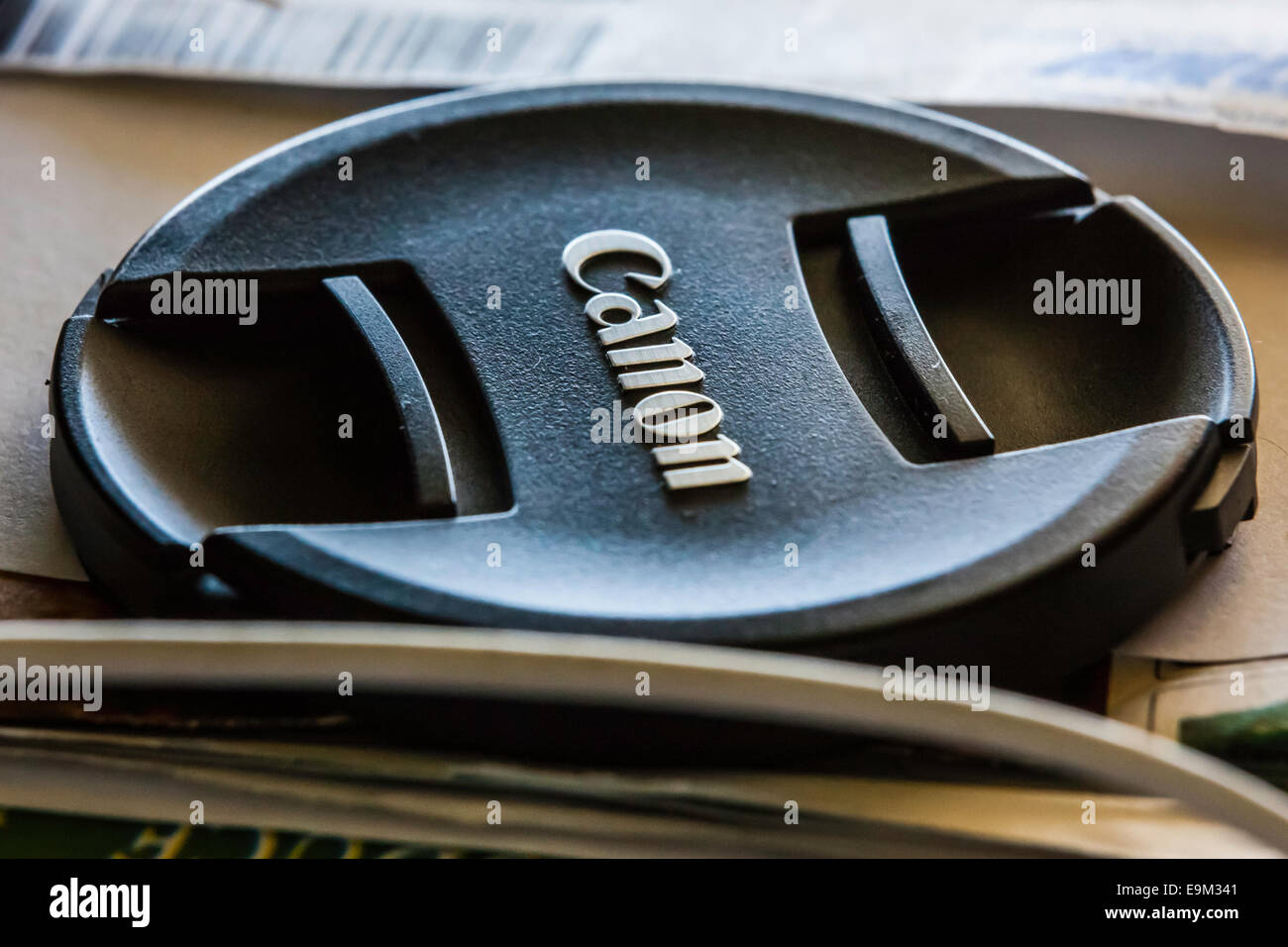 A Canon pinch style Lens cap designed to be removed with the lens hood ...