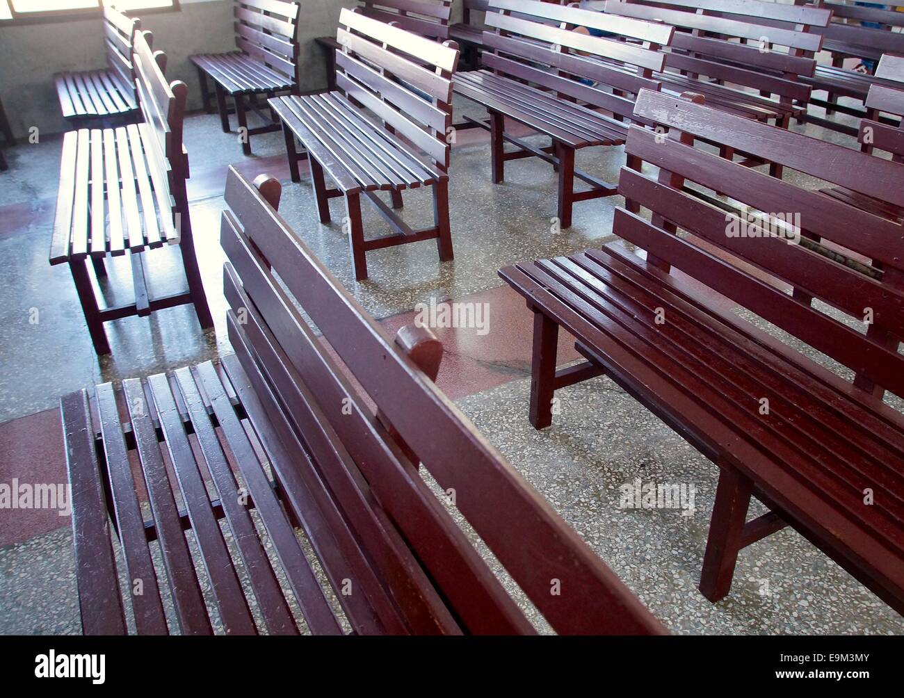 Church pews closeup for prayers in village Stock Photo - Alamy