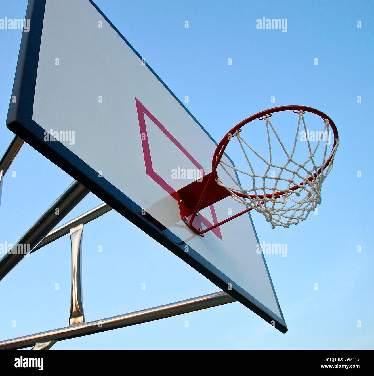 Basketball hoop with net in the playground Stock Photo - Alamy