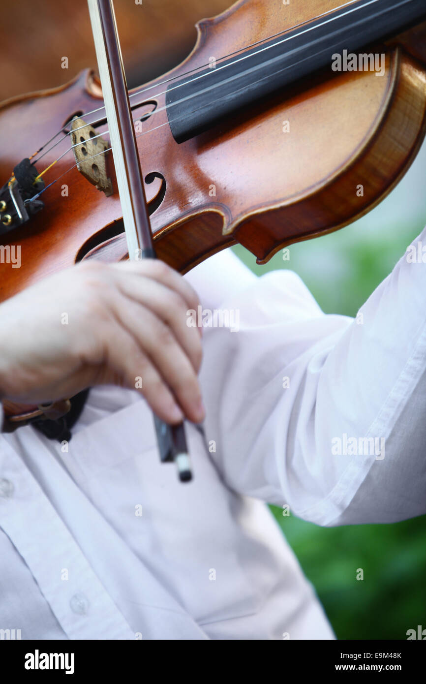 Detail of violin being played by a musician Stock Photo - Alamy