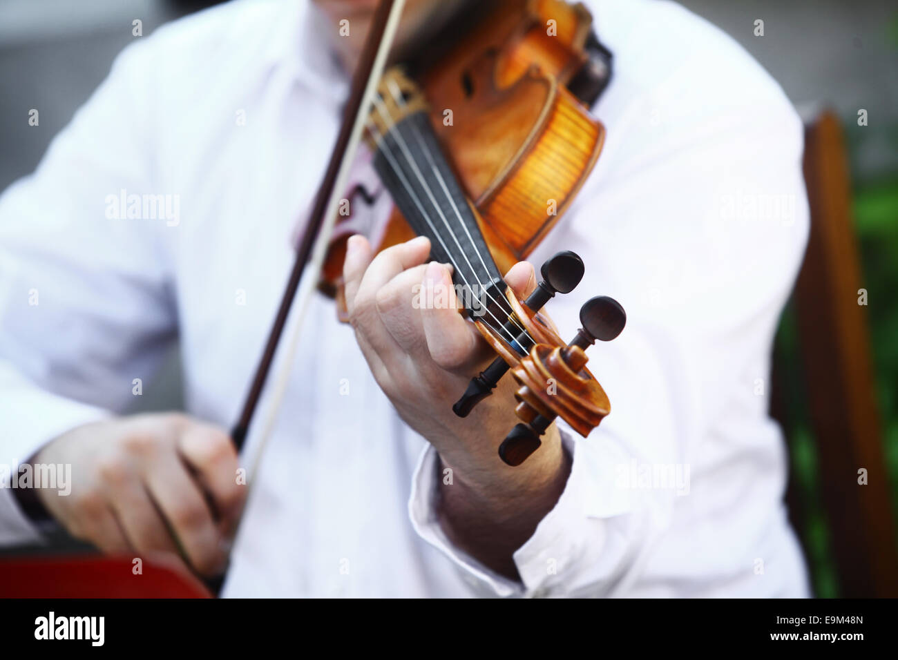 Detail of violin being played by a musician Stock Photo - Alamy