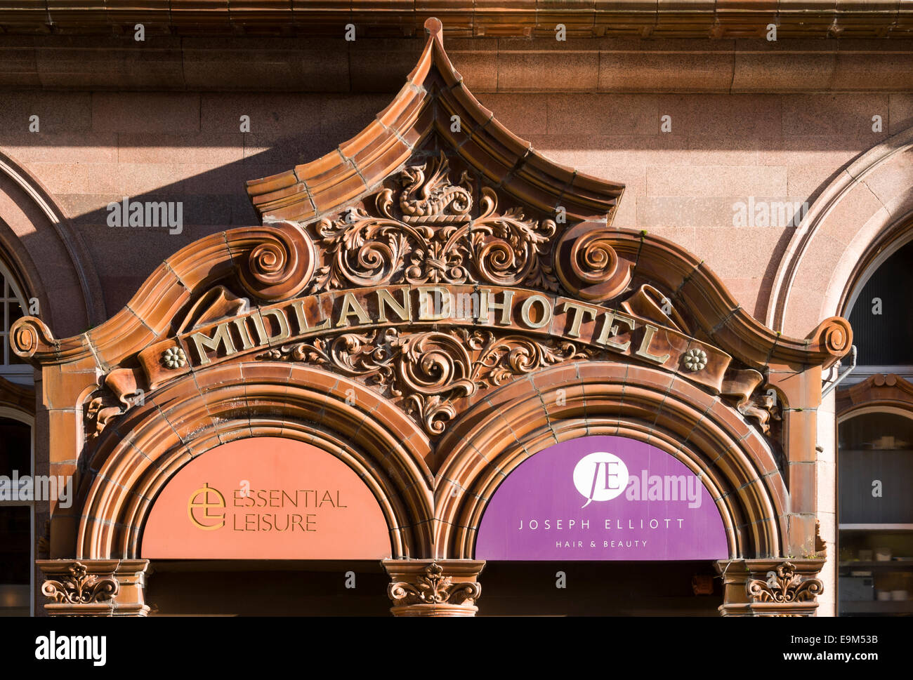 Terracotta sign and decorative work above a door at the Midland Hotel ...
