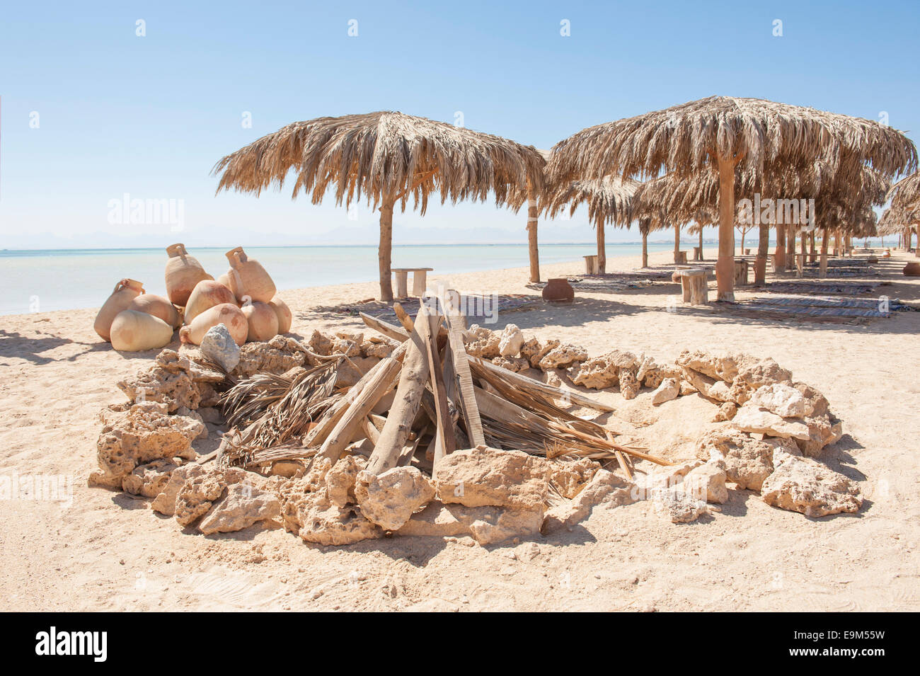 View out to sea from a tropical island beach with bonfire Stock Photo ...