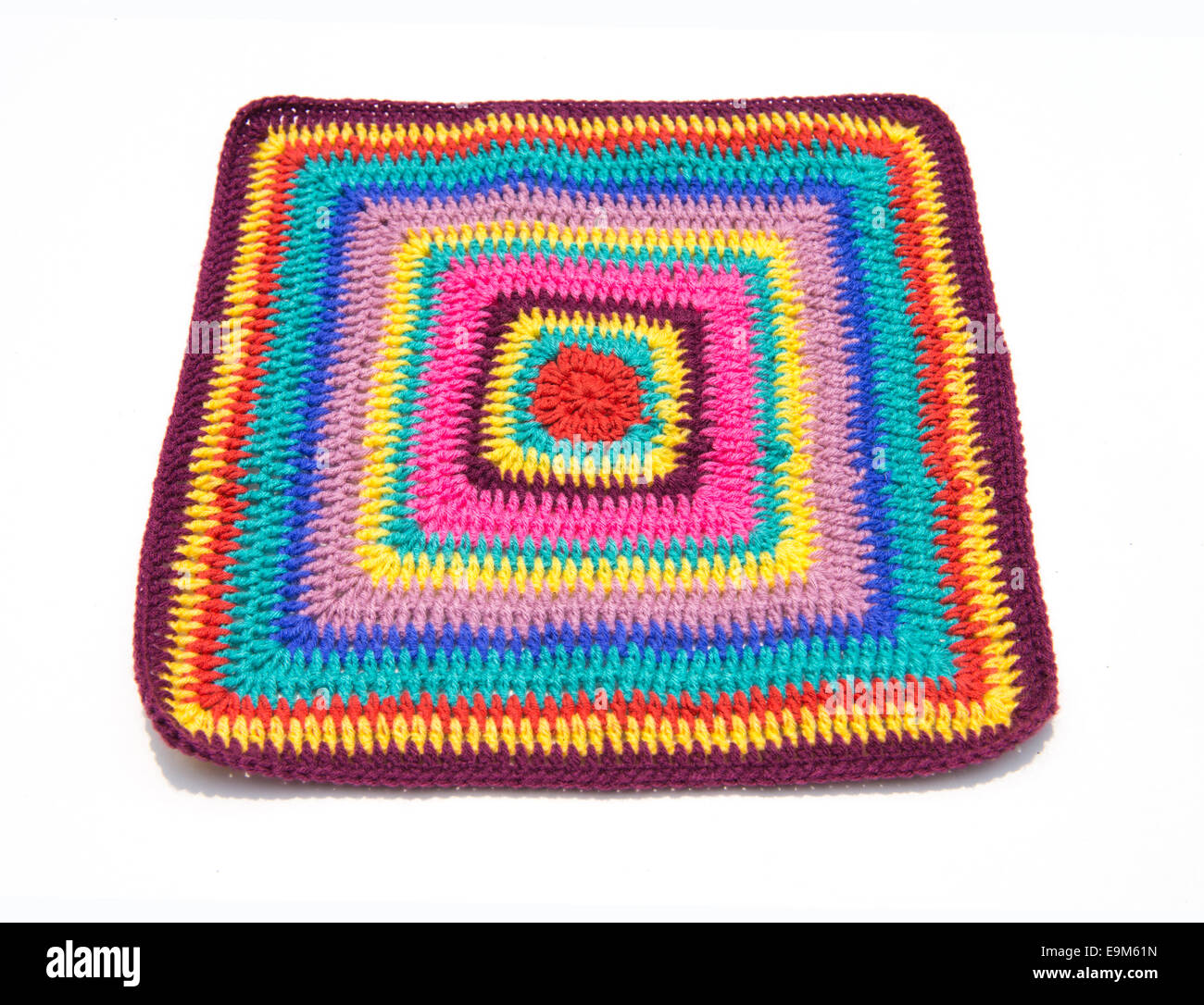 Crochet colorful fabric pattern on white background. Homemade Stock ...