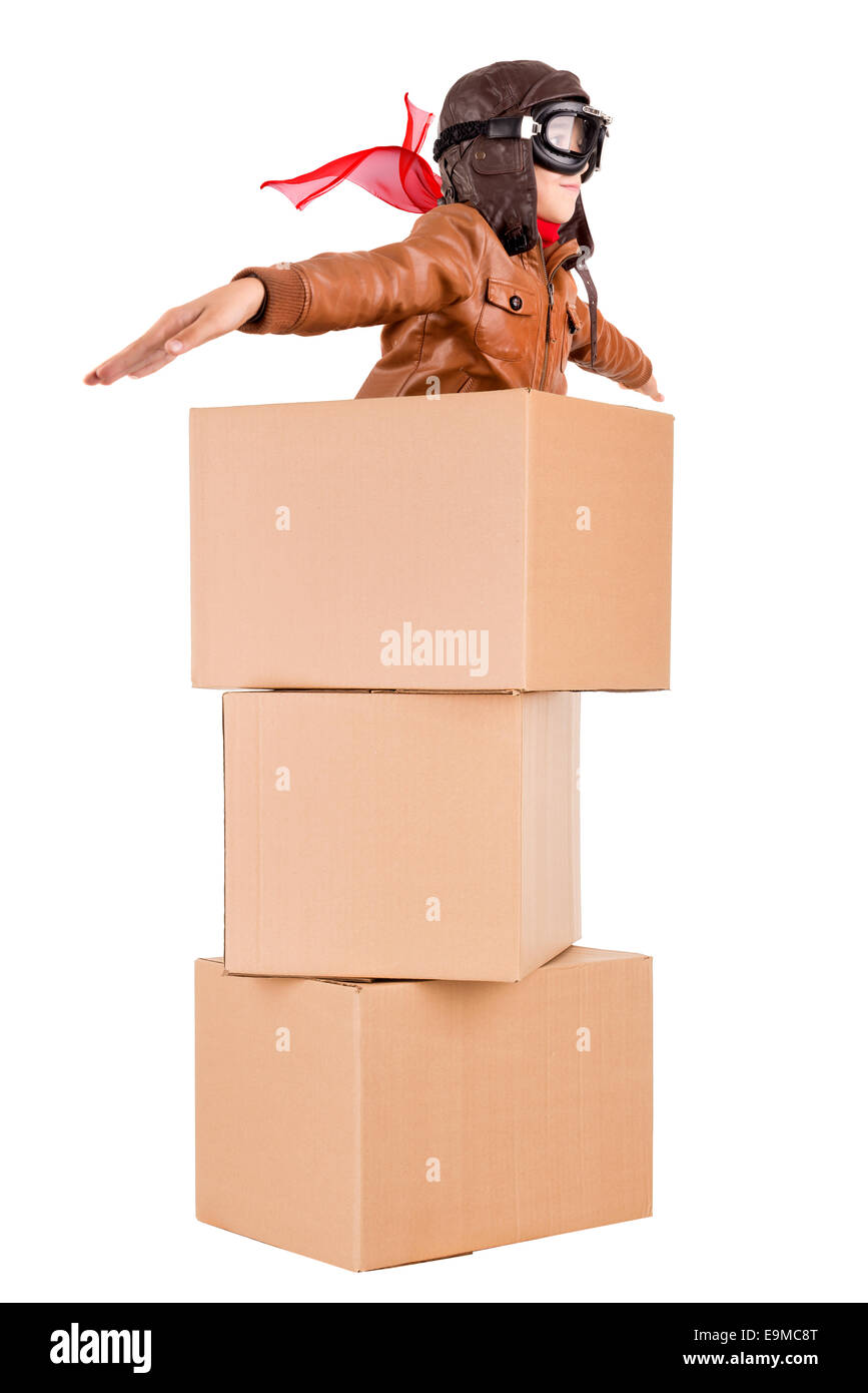 Young boy pilot flying a cardboard box isolated in white Stock Photo ...