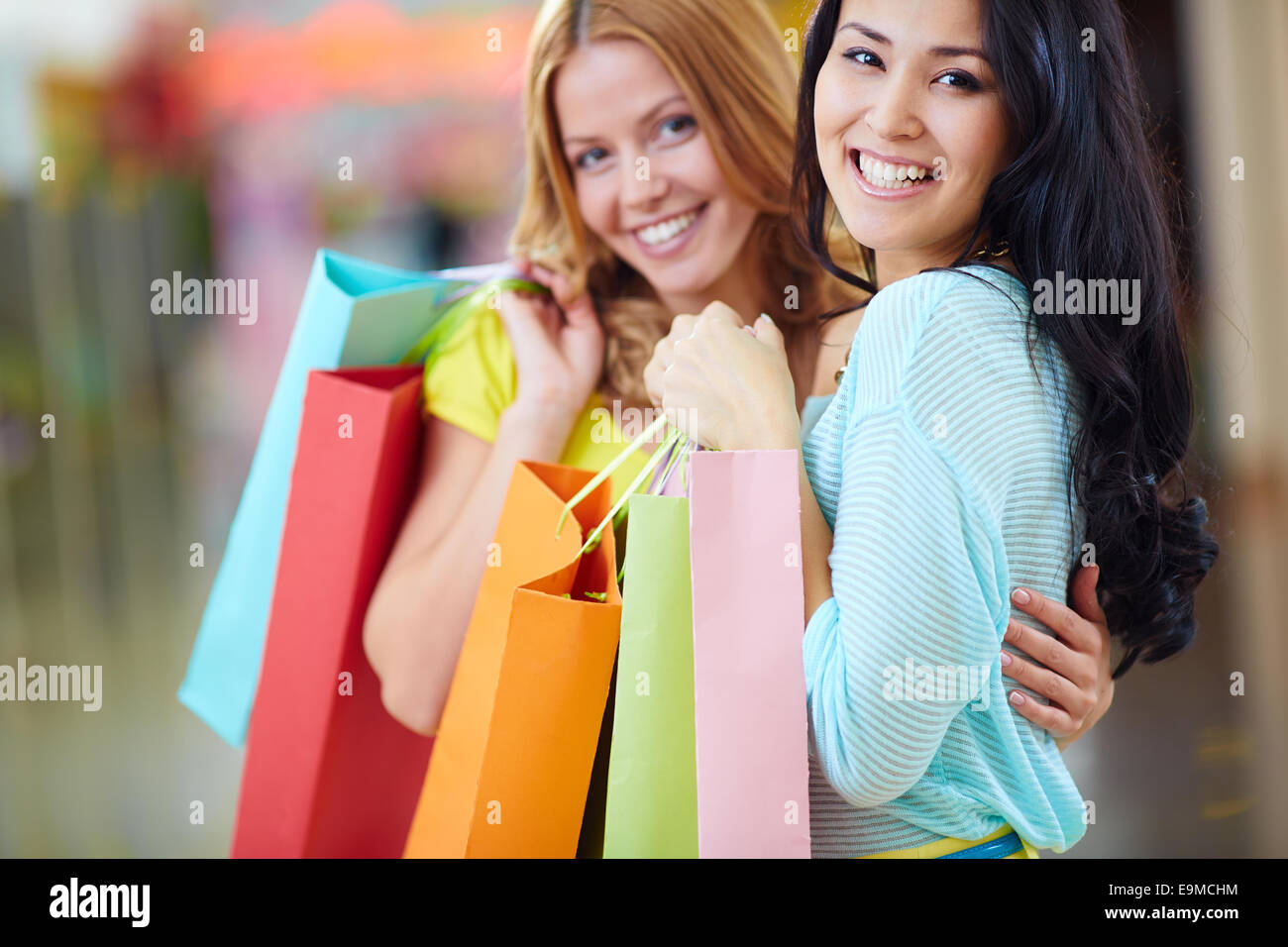 Portrait of two happy female shoppers in smart casual Stock Photo - Alamy