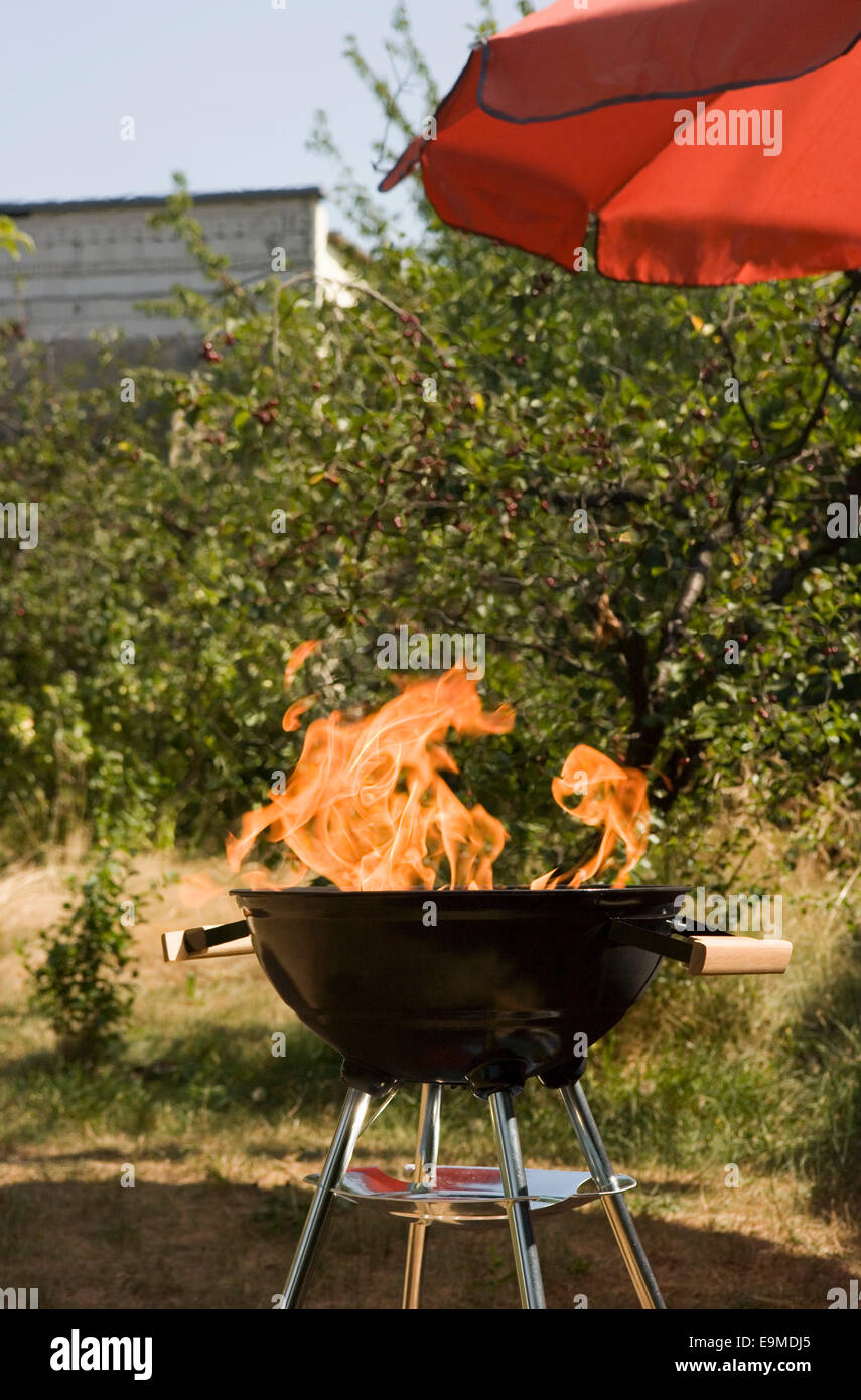 Flaming barbeque grill Stock Photo - Alamy