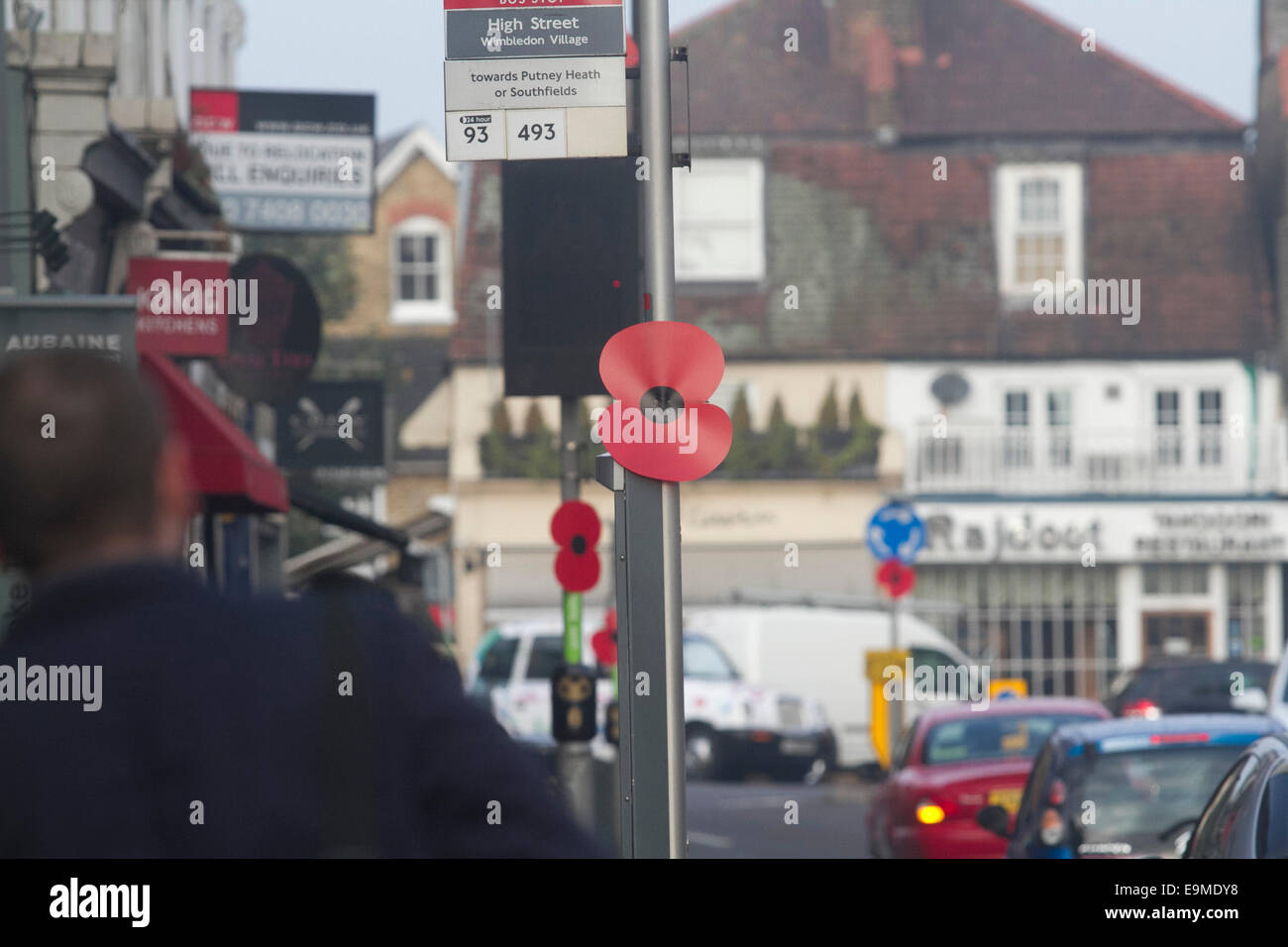 London, UK. 30th October, 2014. Red Poppies decorate bus stops along ...