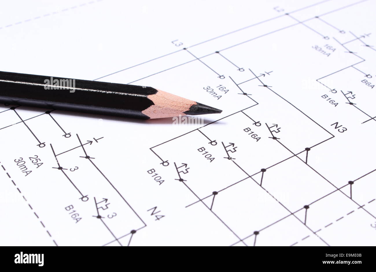 Black pencil lying on electrical diagrams, drawing for the projects ...