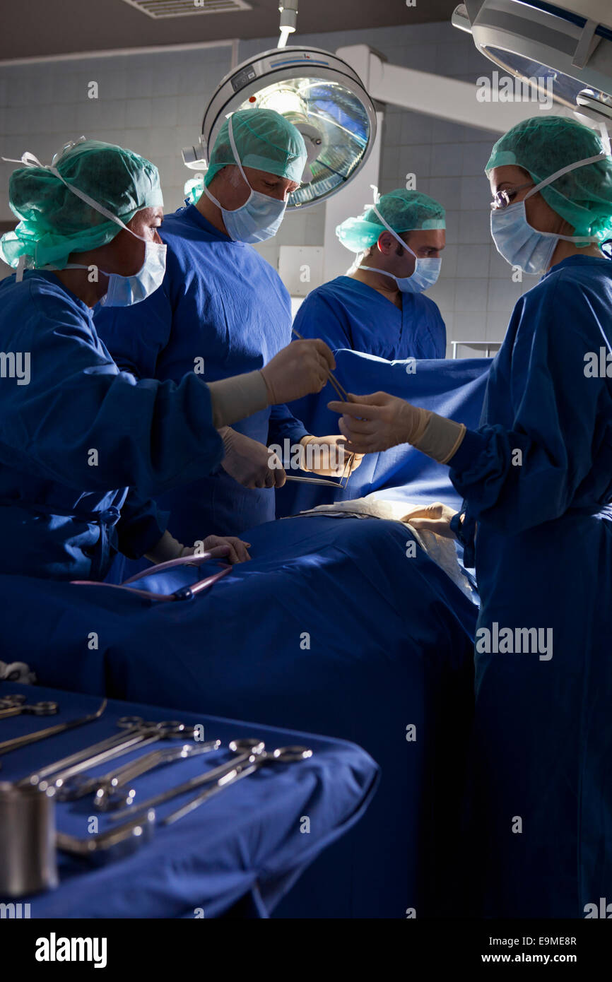 Surgical team operating room vertical hi-res stock photography and ...