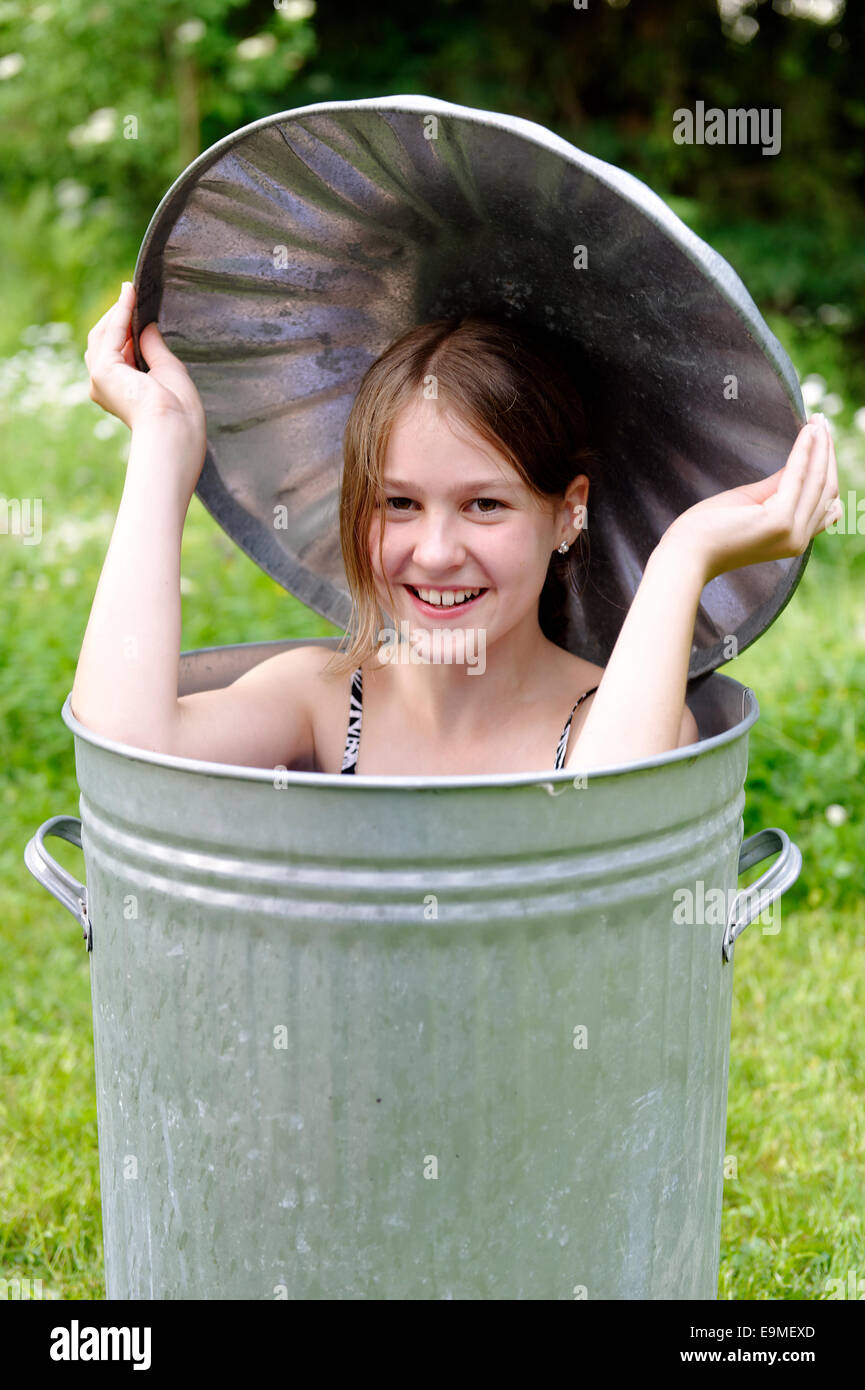 Laughing girl sitting in a barrel Stock Photo - Alamy