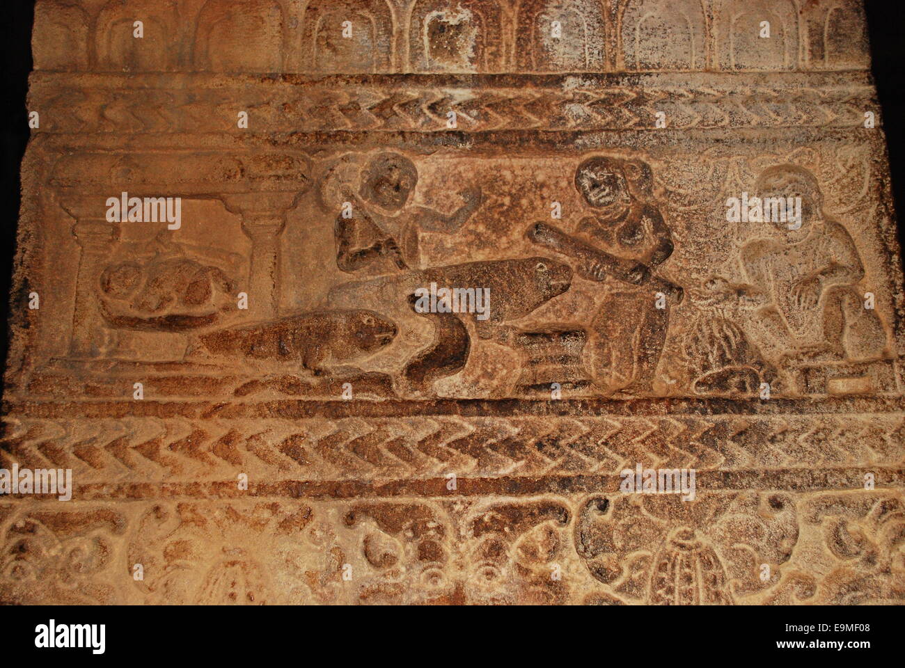 Fighting monsters on the wall of an ancient Hindu temple Stock Photo ...