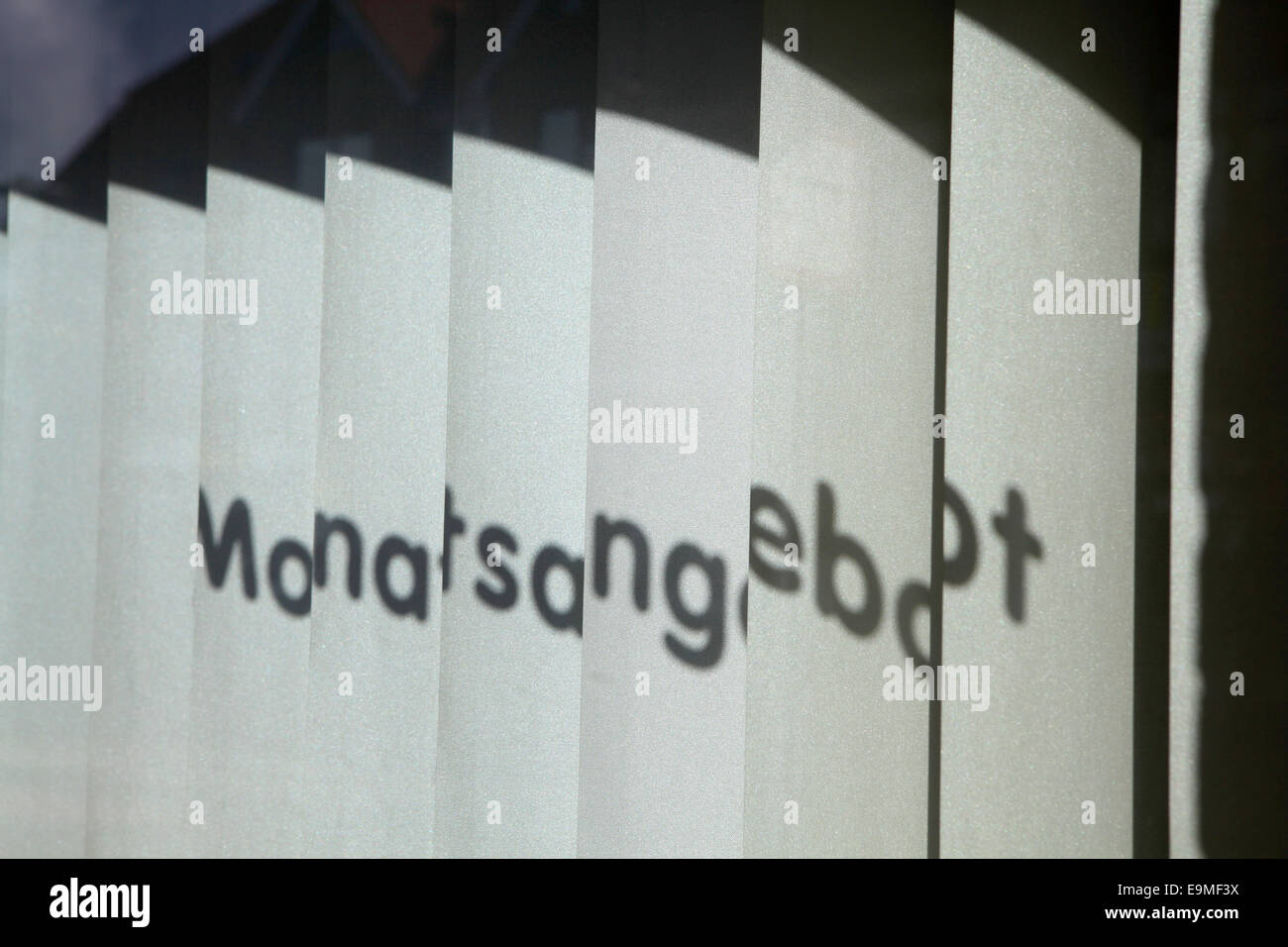 Shadow of text on shop window Stock Photo - Alamy
