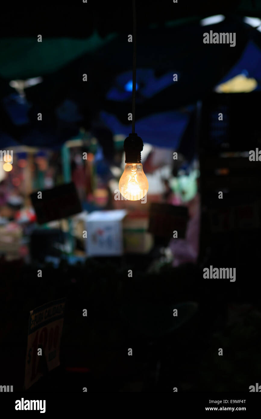 Lit light bulb in room Stock Photo - Alamy