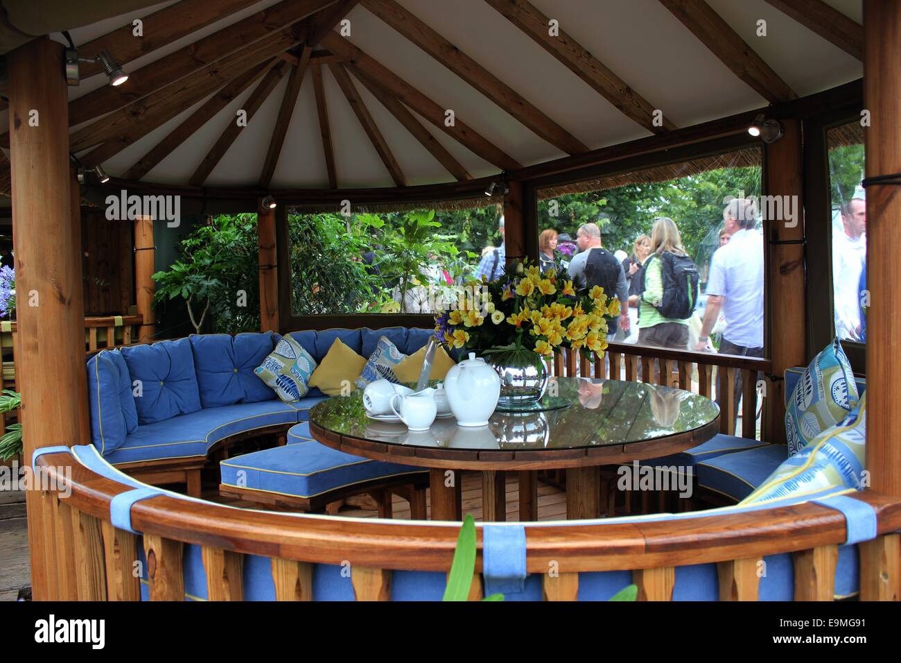 Outdoor Setup with seating with cushions and dining table Stock Photo ...