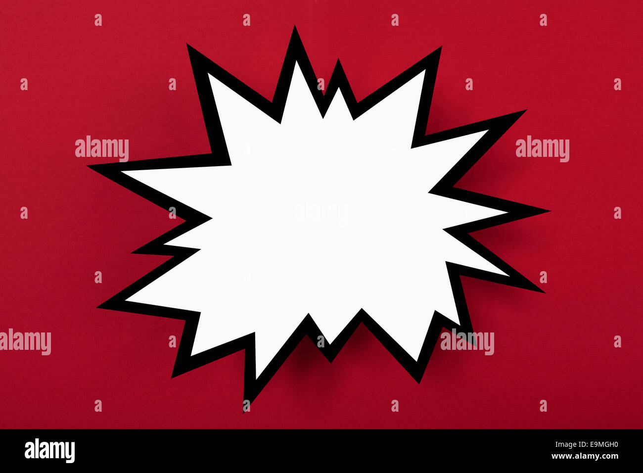 Exploding speech bubble against red background Stock Photo - Alamy