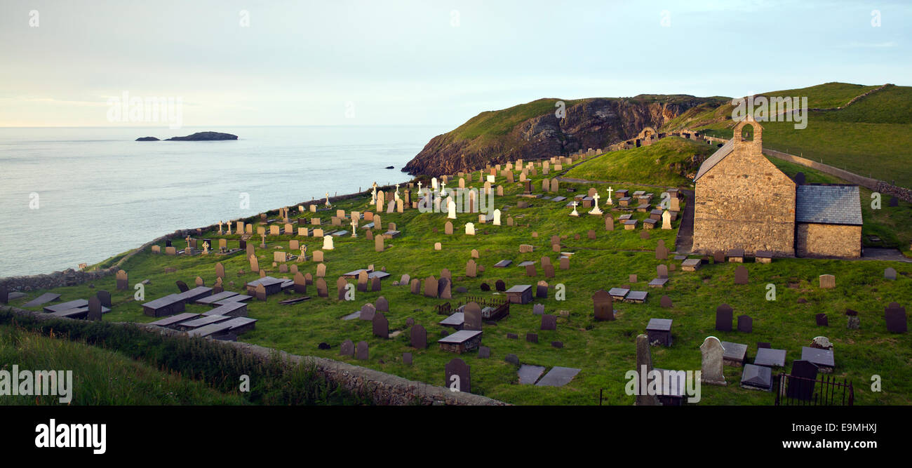 St Patricks Church and churchyard on the cliff top at Llanbadrig at the ...
