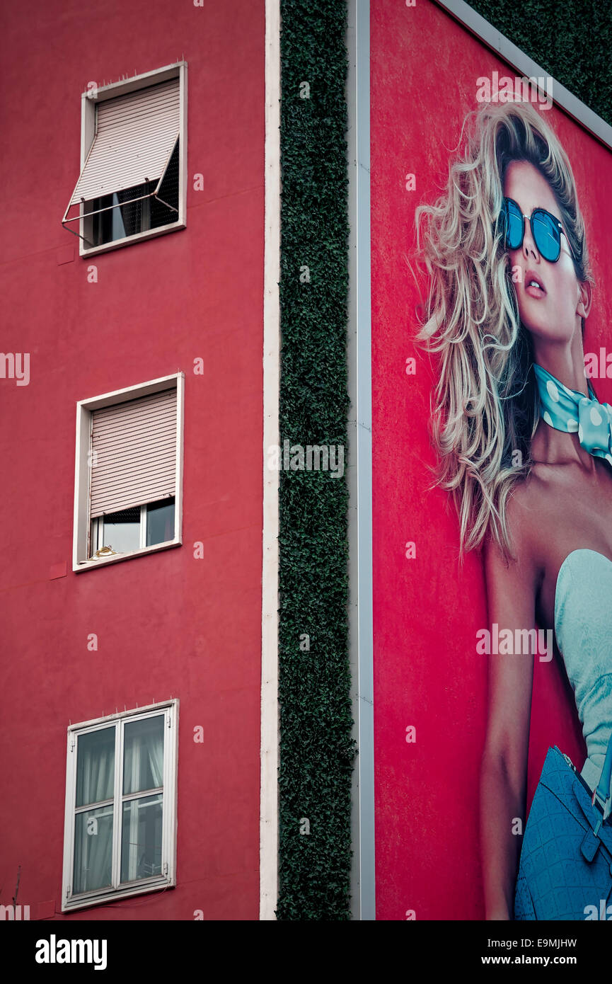 Giant wall advertising on building facade Stock Photo - Alamy