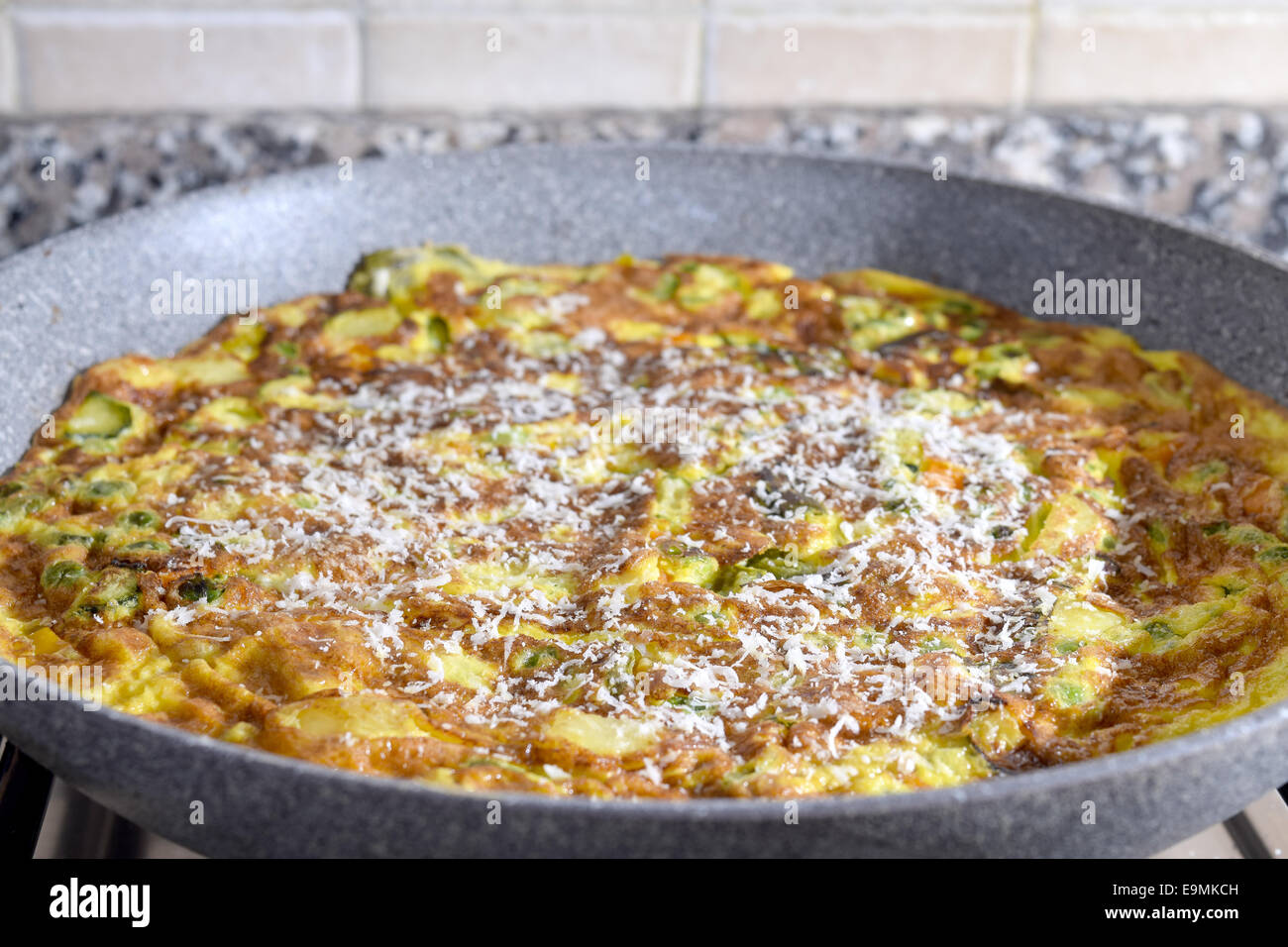 omelette with zucchini and parmesan Stock Photo - Alamy