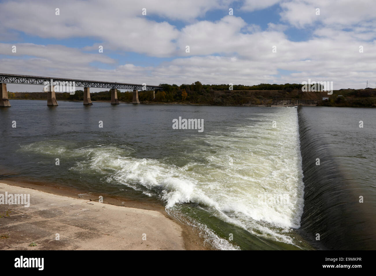 weir and cpr train railway bridge over the south Saskatchewan river ...